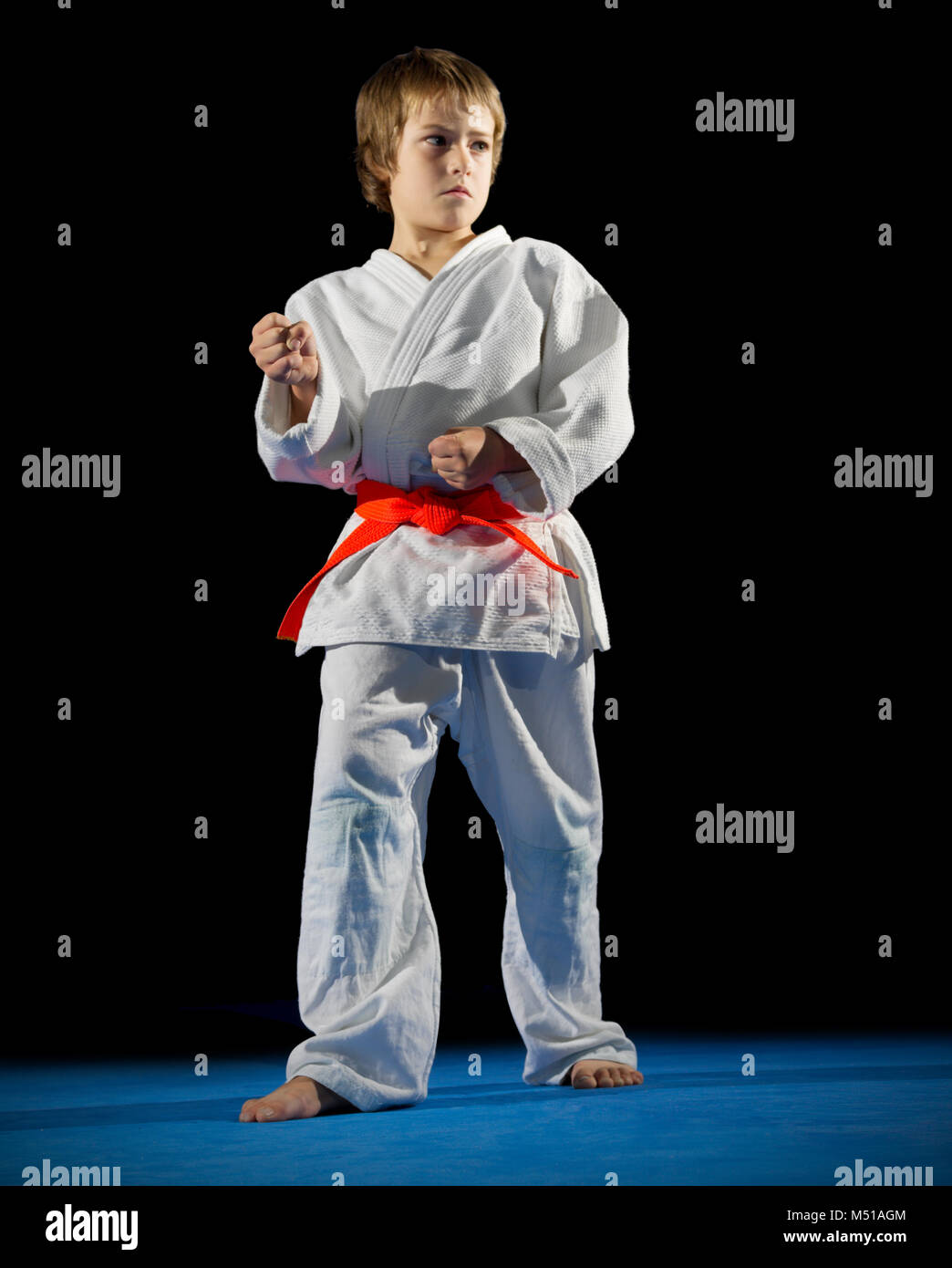 Little boy martial arts fighter isolated Stock Photo - Alamy