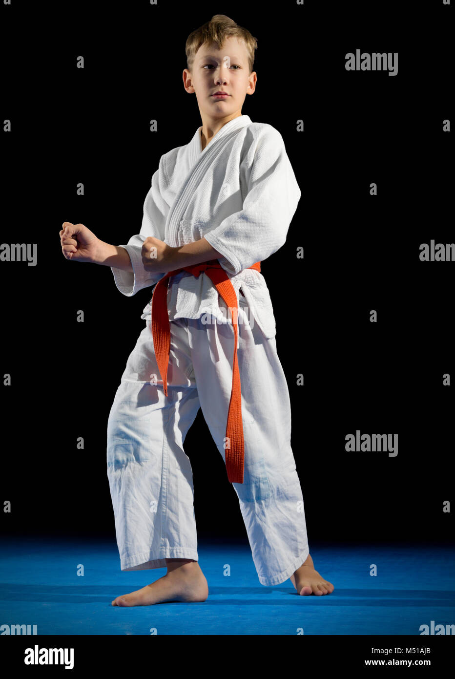 Little boy martial arts fighter isolated Stock Photo - Alamy