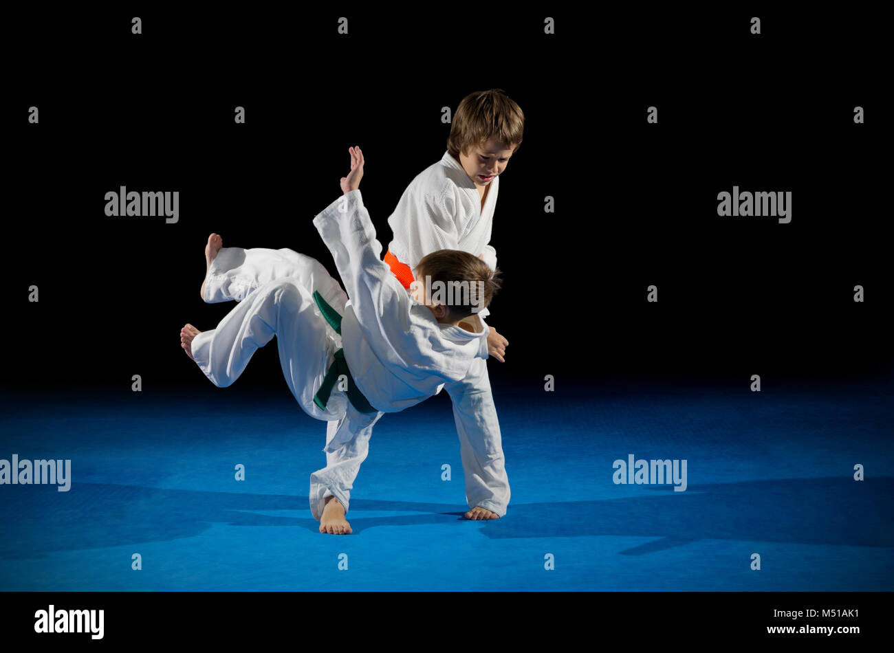 Little boys martial arts fighters isolated Stock Photo - Alamy