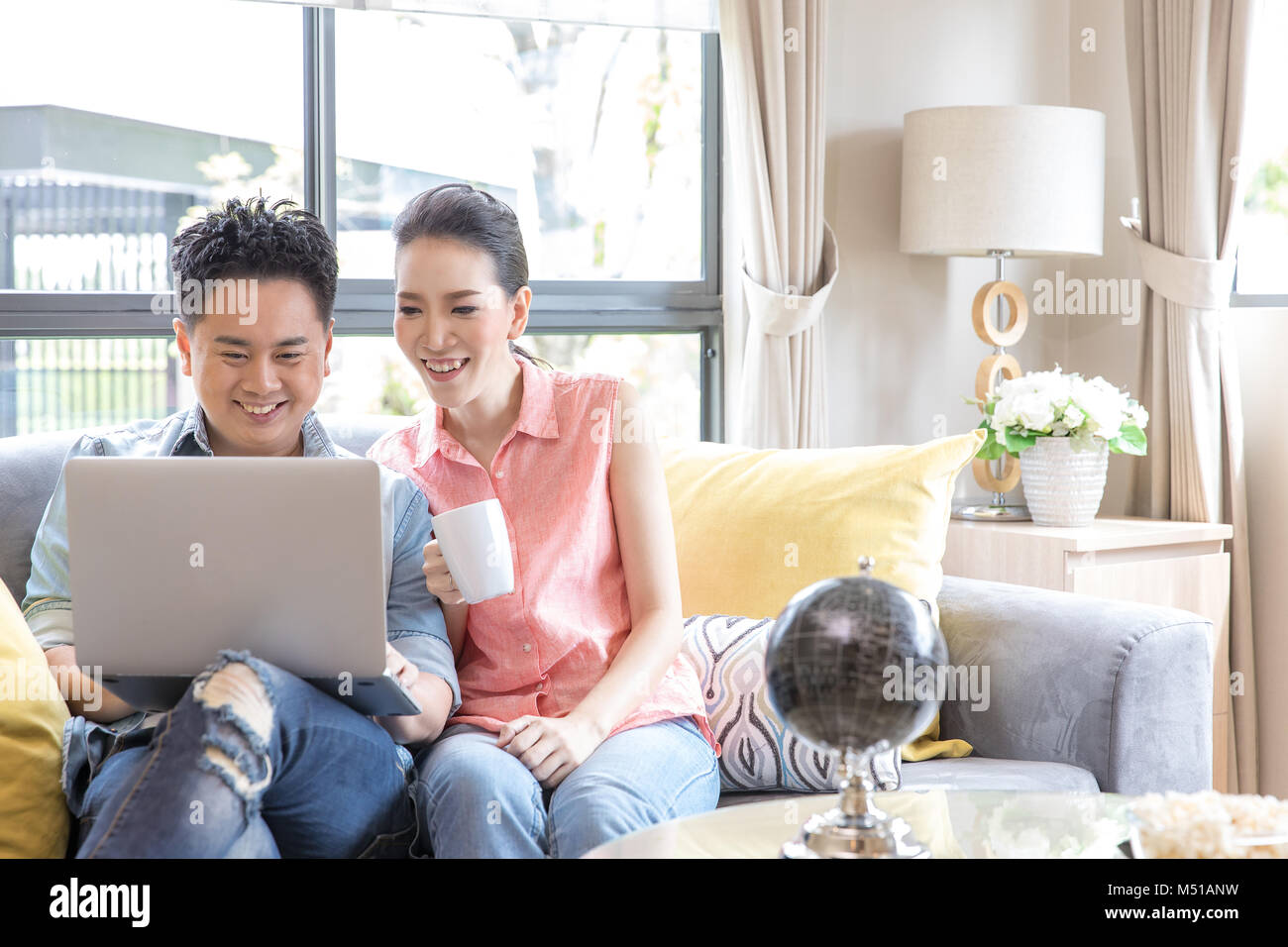 Young Couples using laptop Stock Photo - Alamy