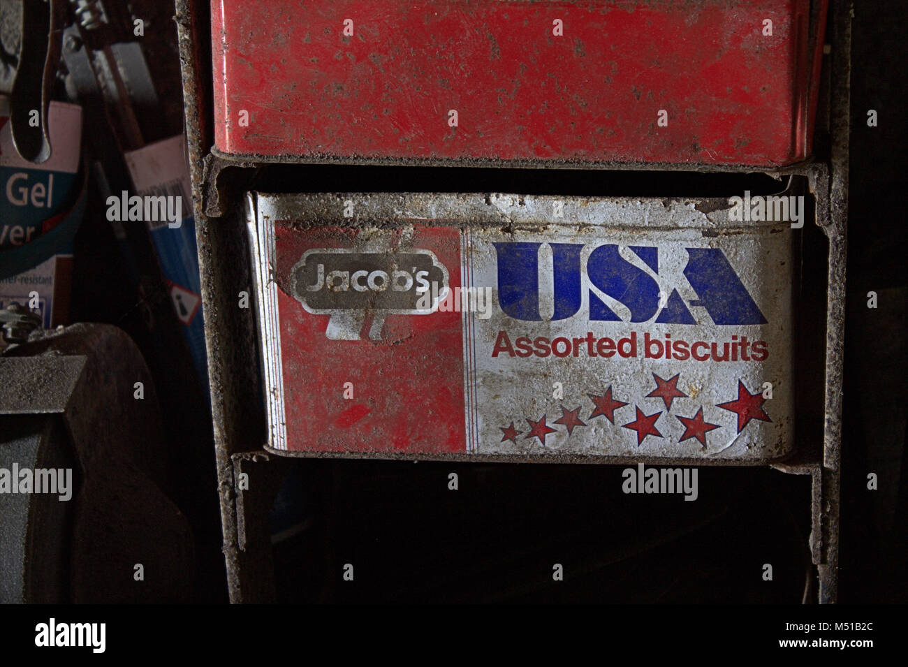 Old assorted biscuit tin being used as a storage box, long forgotten at ...
