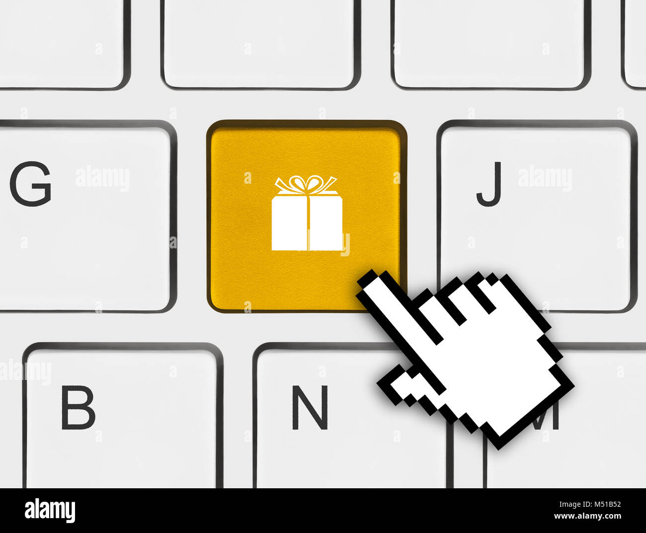Computer keyboard with gift key Stock Photo - Alamy