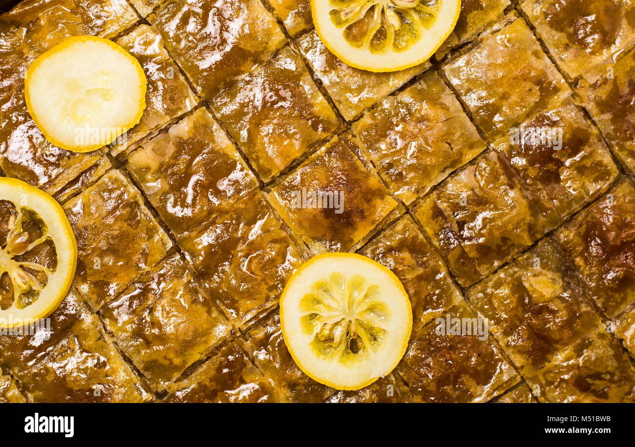 Whole baklava with lemon on a making texture pattern Stock Photo - Alamy