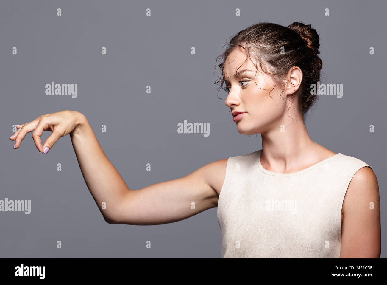 Young woman showing and presenting copy space by fingers Stock Photo ...