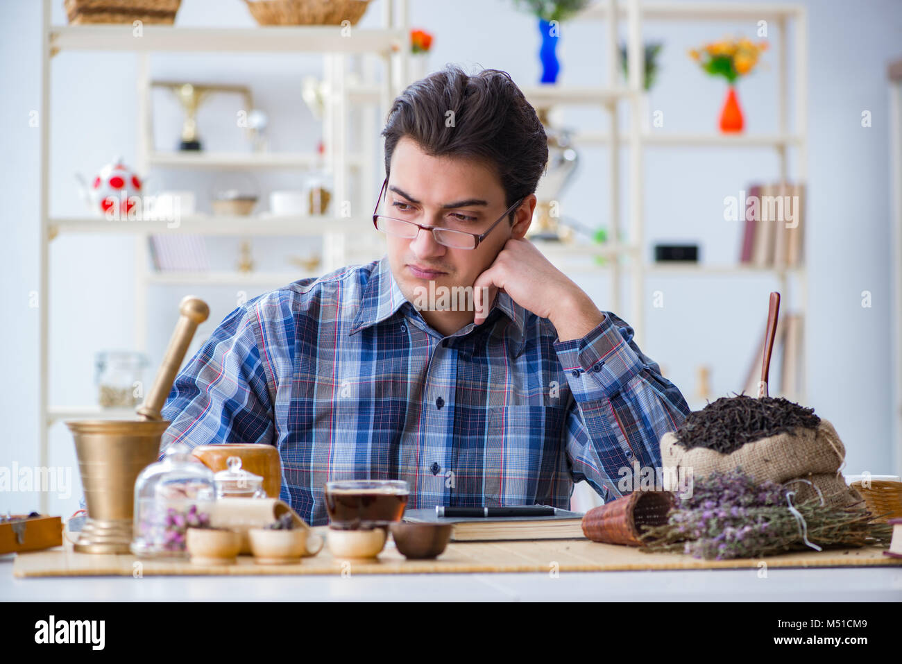 The professional tea expert trying new brews Stock Photo - Alamy