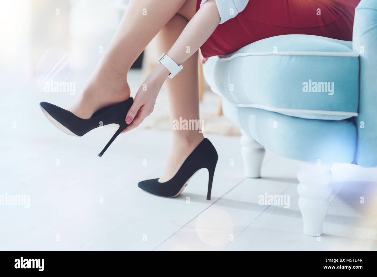 Scaled up look on business woman taking off high heels Stock Photo - Alamy