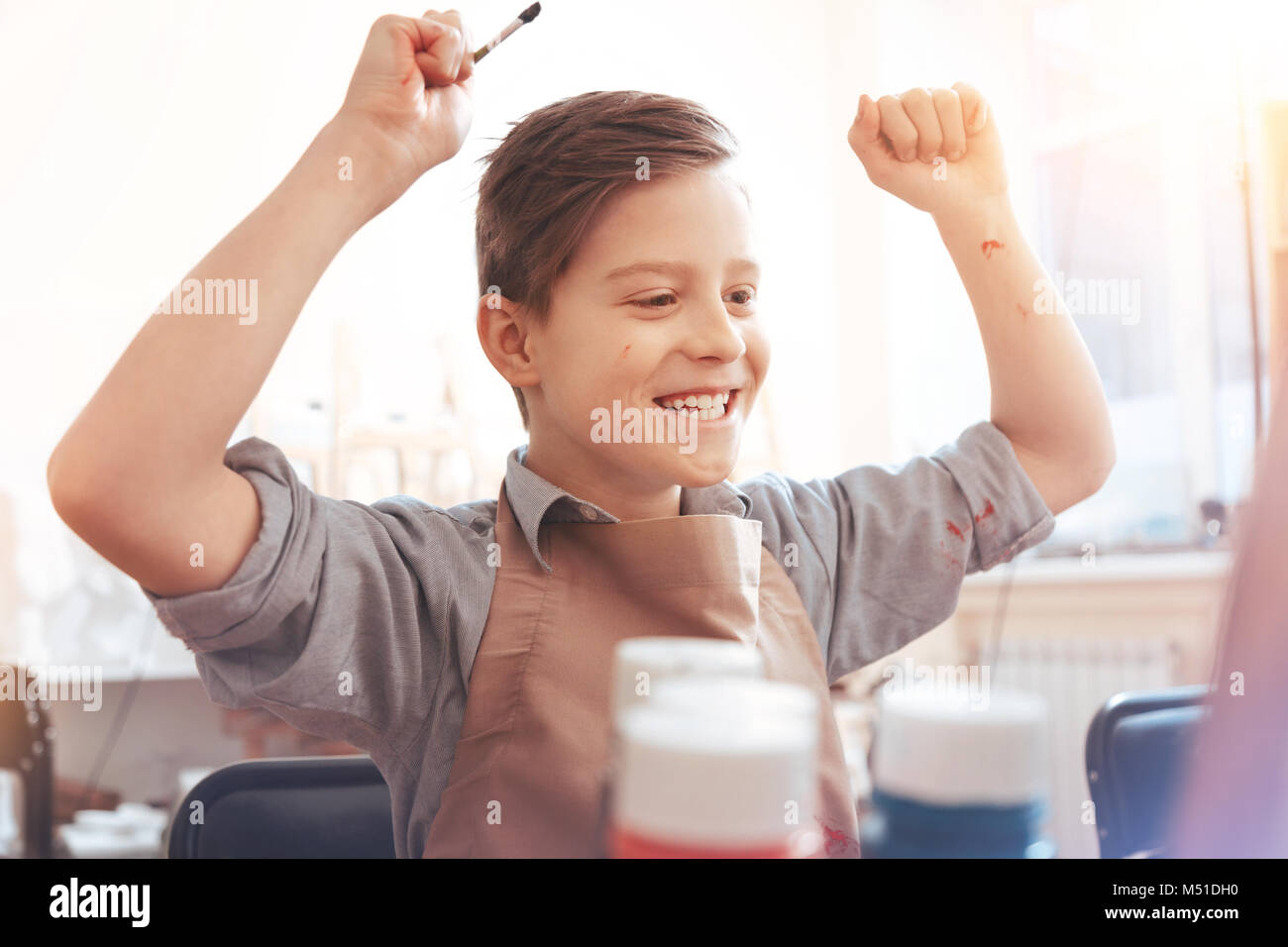 Overwhelmed with emotions boy getting excited while painting Stock ...