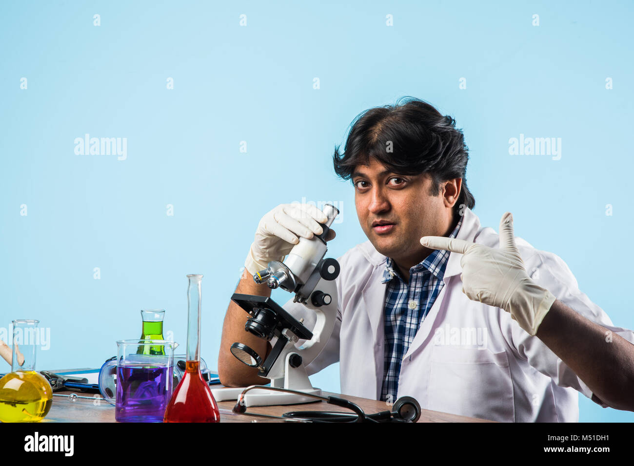Indian Doctor With Microscope High Resolution Stock Photography and ...