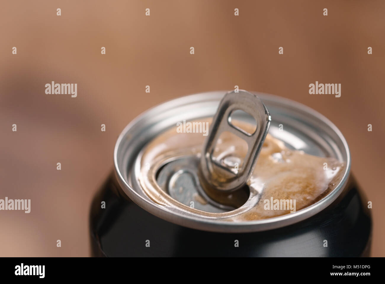 open black can with beverage, shallow focus Stock Photo - Alamy