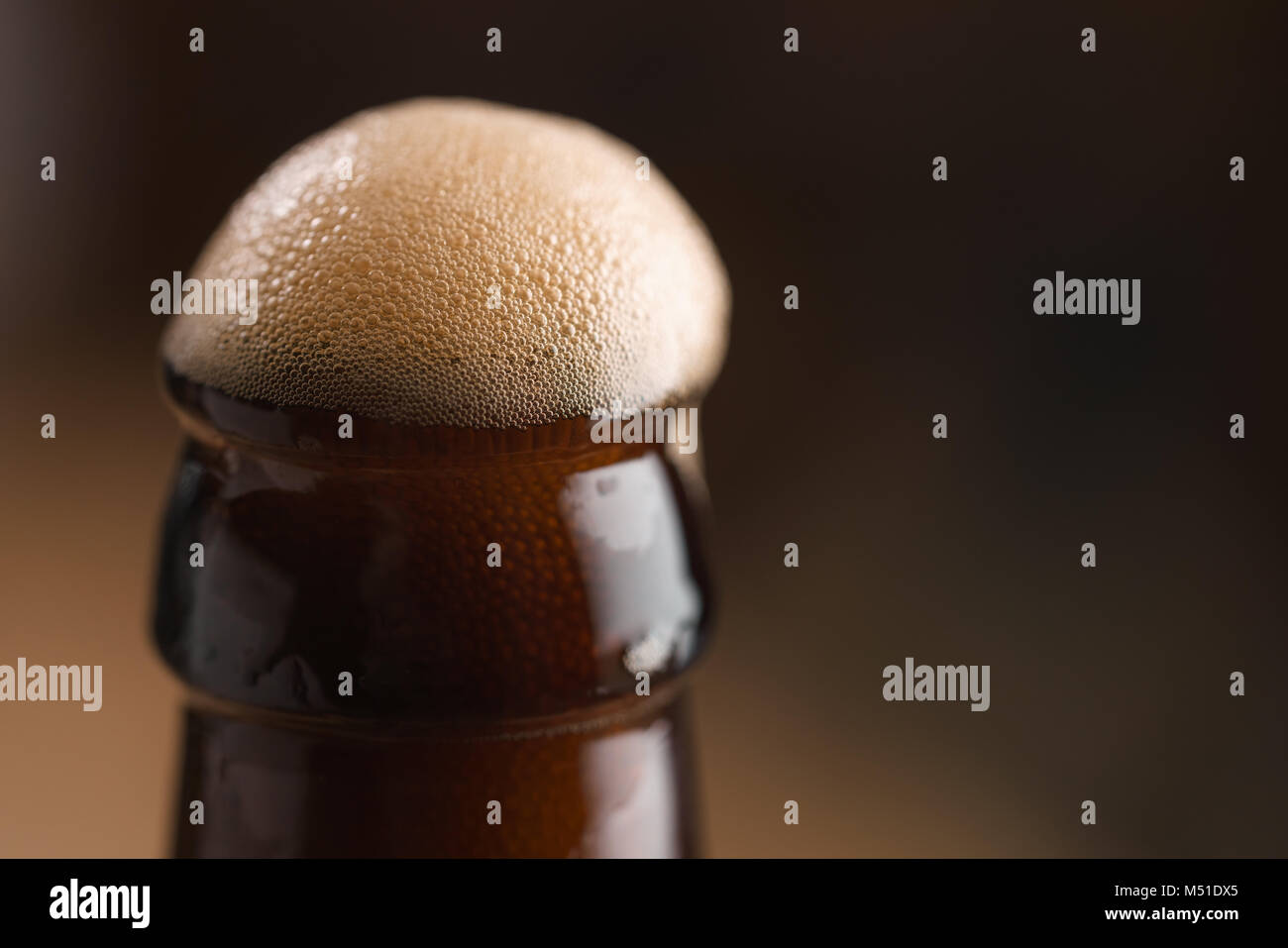 brown beer bottle neck with foam closeup photo, shallow focus Stock ...