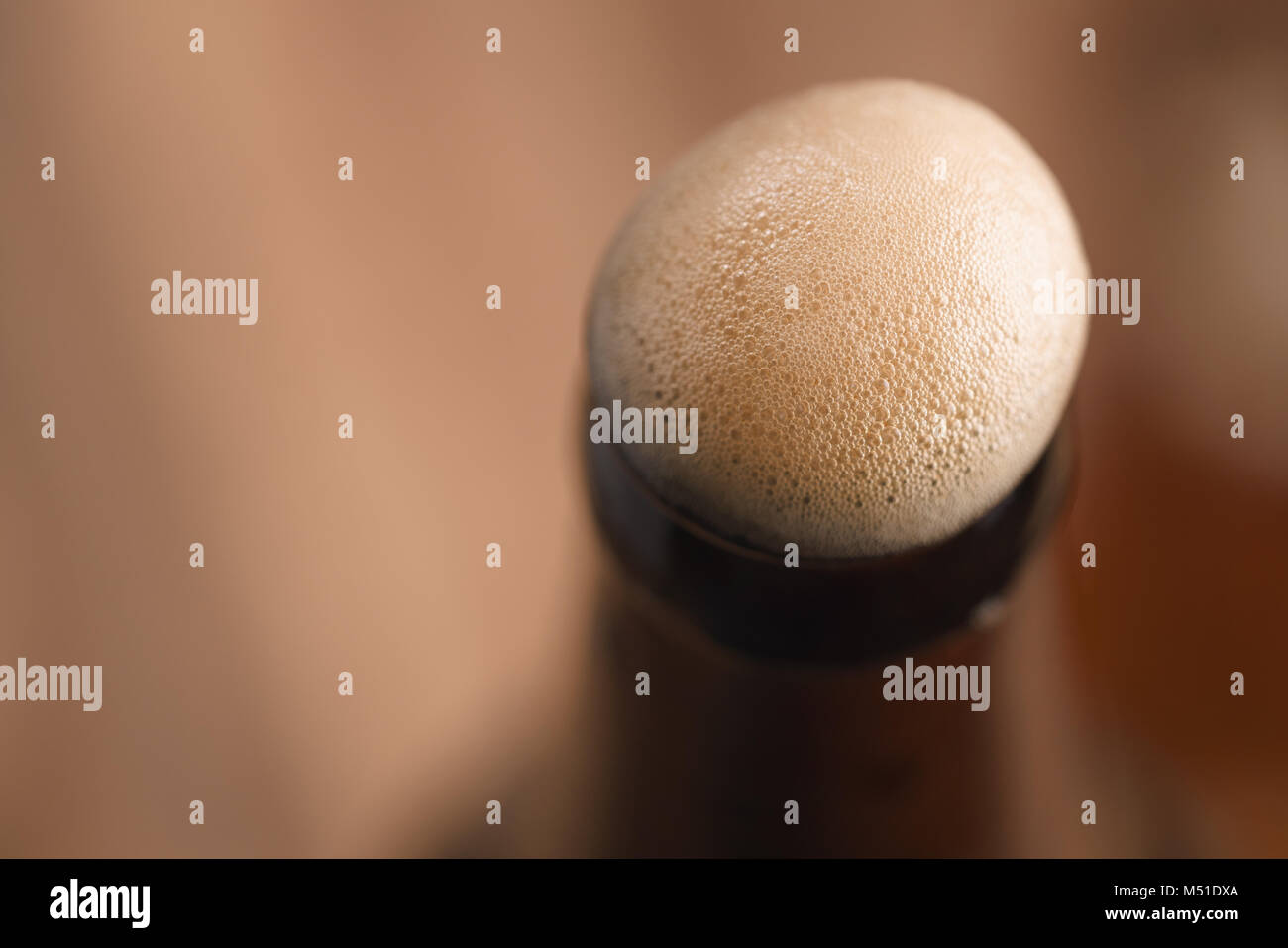brown beer bottle neck with foam closeup photo, shallow focus Stock ...