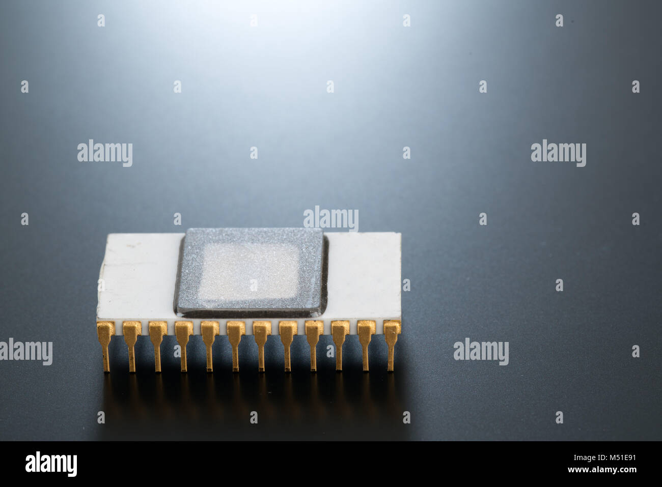 Electronic chip isolated on dark blue Stock Photo - Alamy