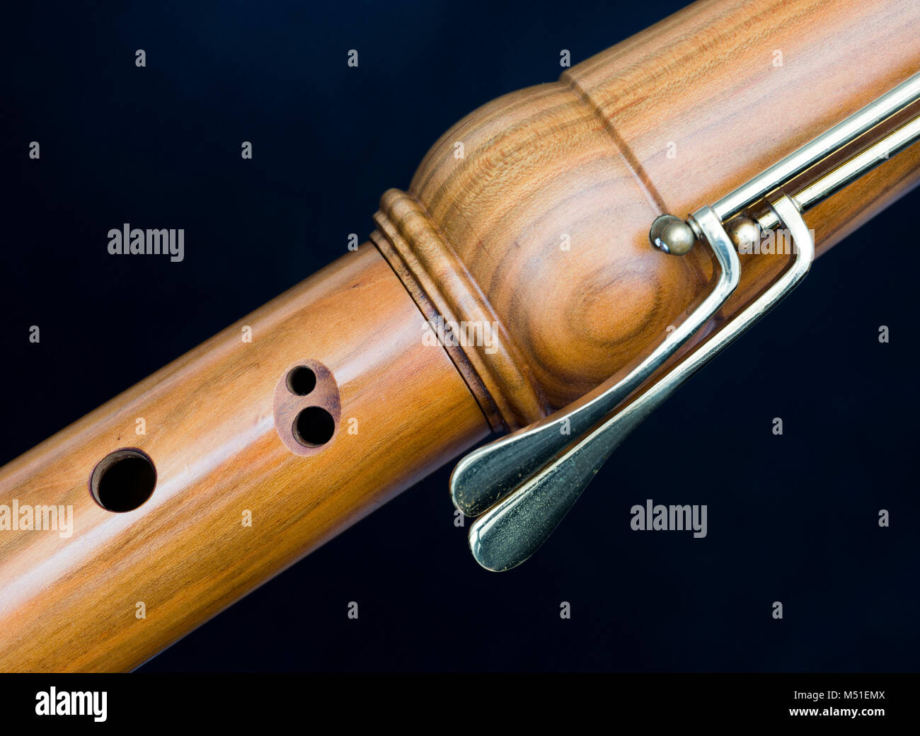 part of bass recorder against dark background Stock Photo - Alamy