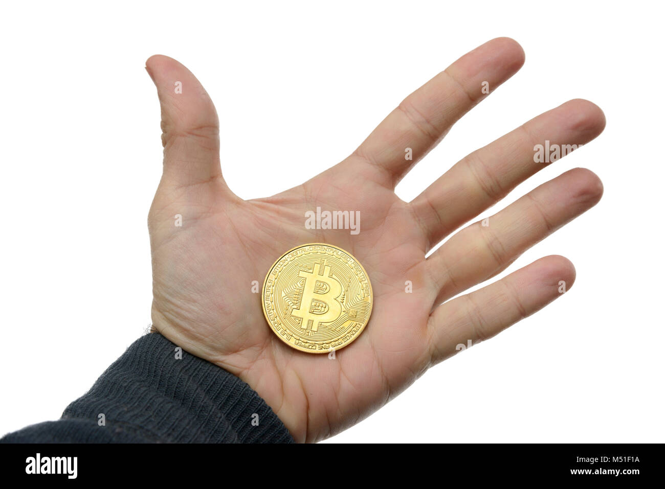 Person holding golden Bitcoin token Stock Photo - Alamy