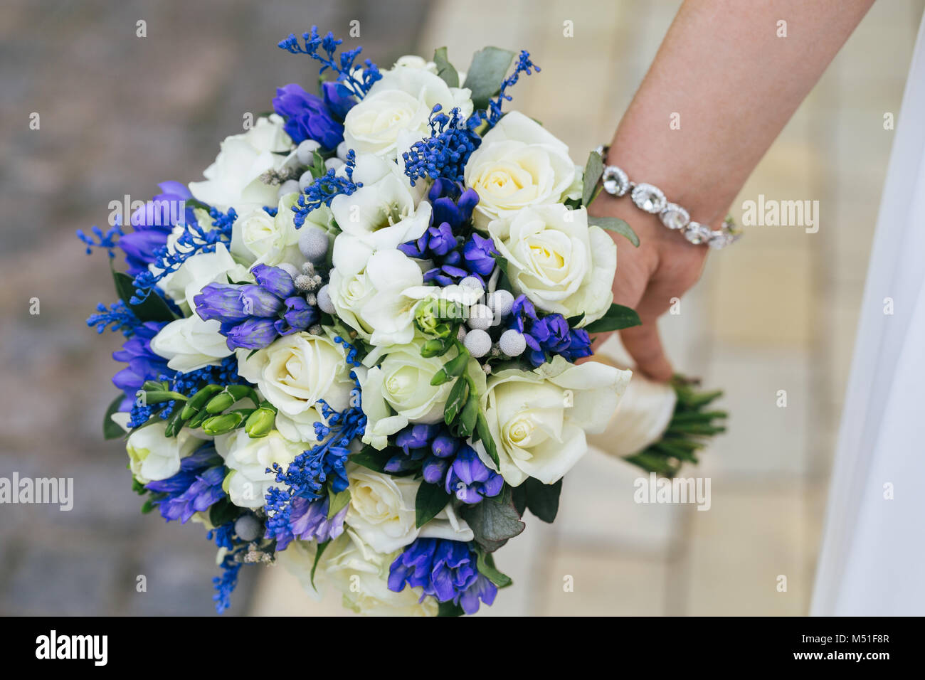 The bride is holding a wedding bouquet Stock Photo - Alamy