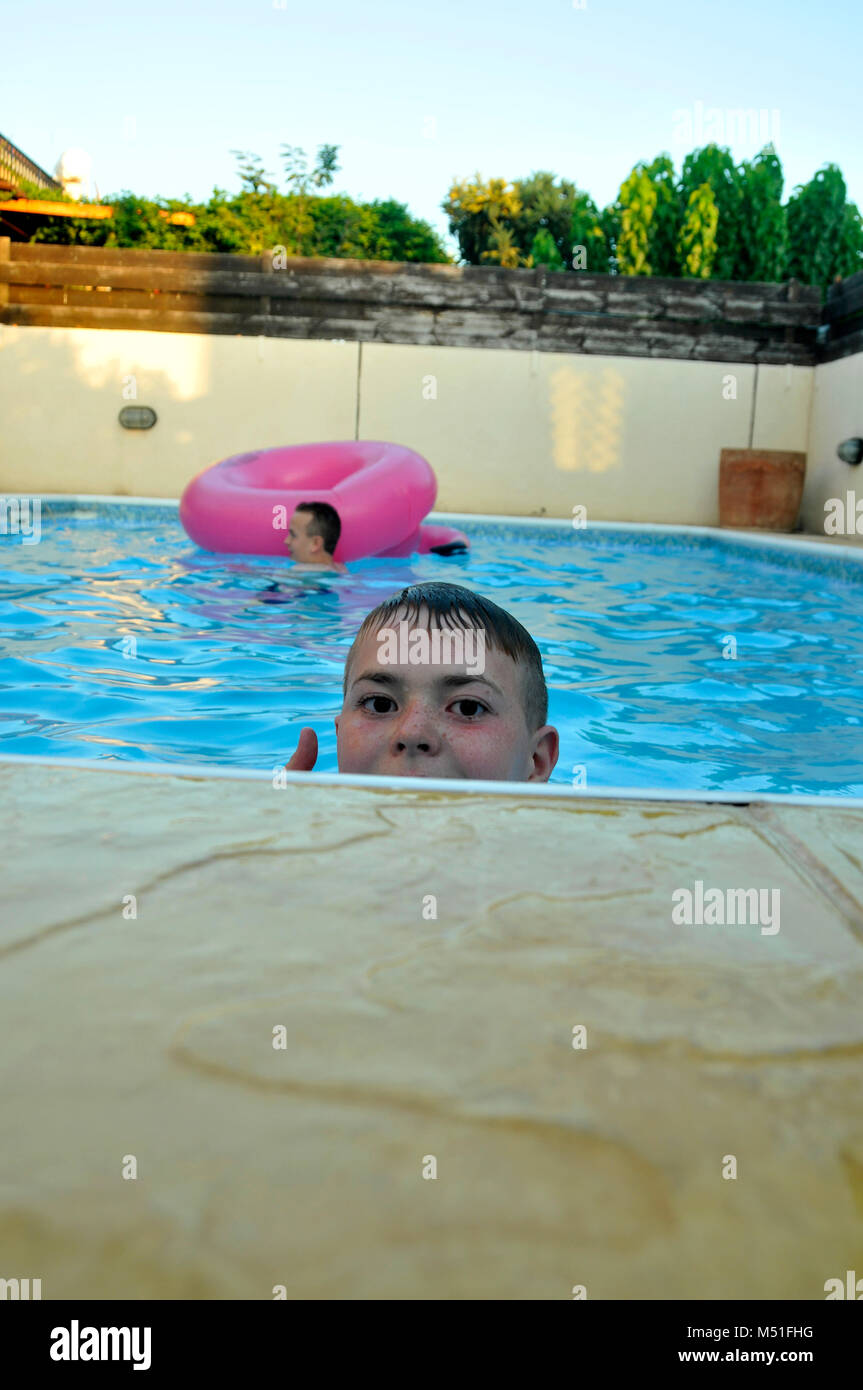 Boy in pool Stock Photo - Alamy