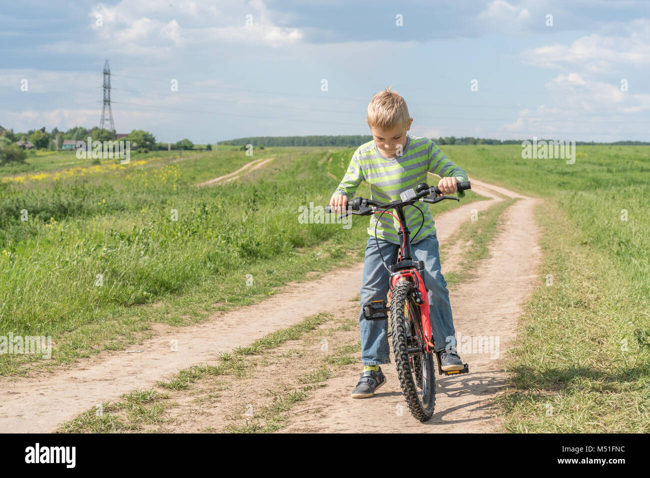 Happy boy running on the field Stock Photo - Alamy