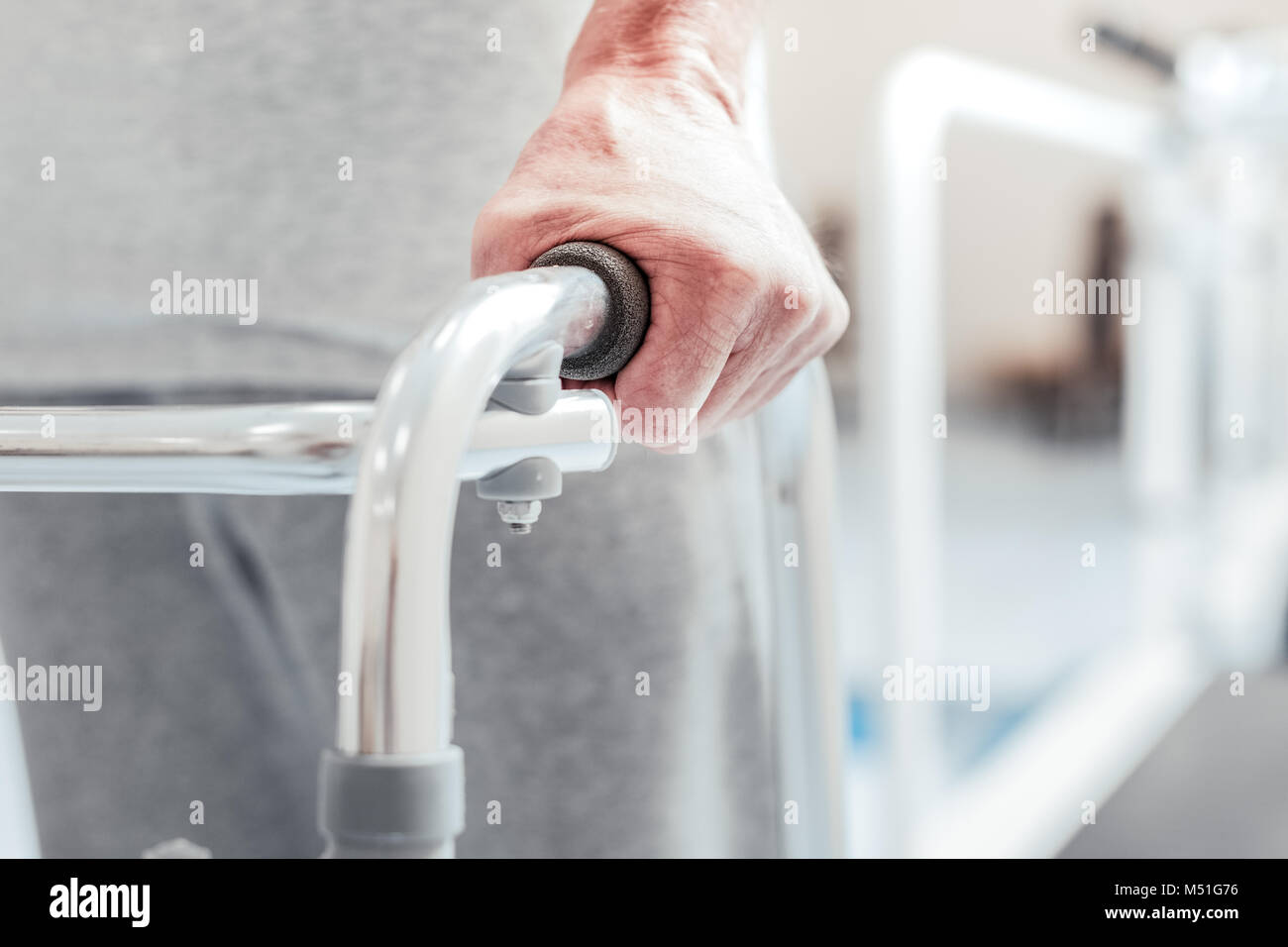 Old masculine hand holding a handle Stock Photo - Alamy