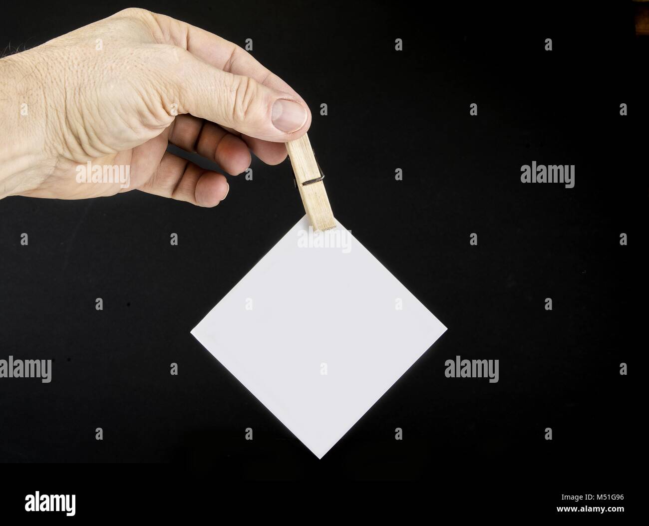 Paper note on the finger fixed with clothes pin Stock Photo - Alamy
