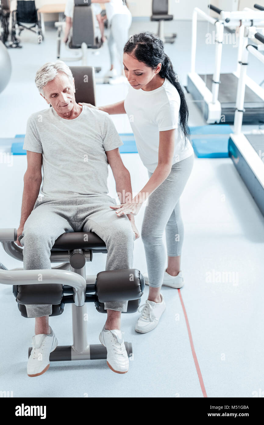 Serious trainer telling her trainee what to do Stock Photo - Alamy
