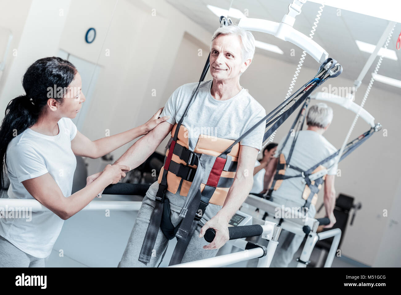 Happy old man training his muscles Stock Photo - Alamy