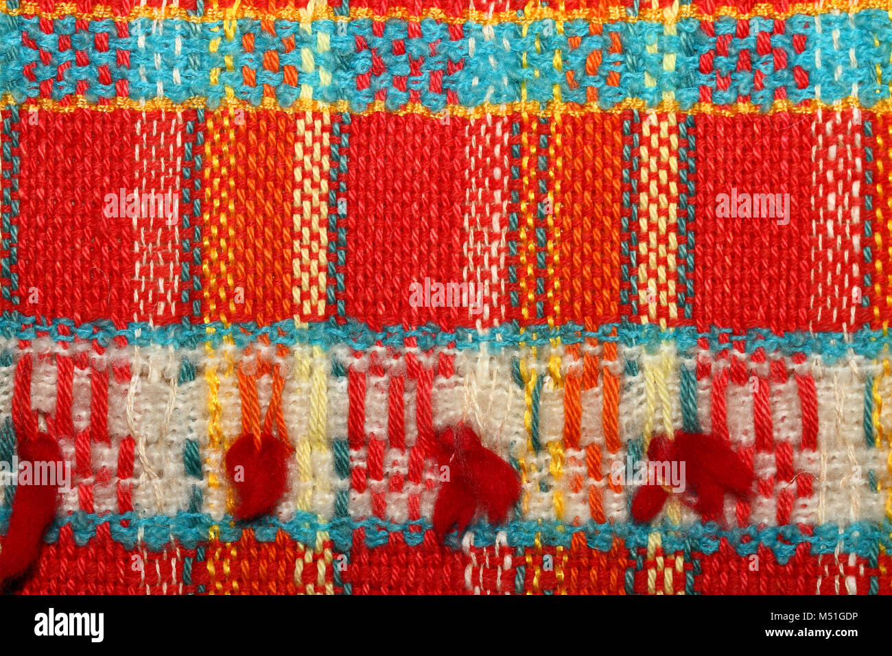 Textured woollen woven piece of material in bright colourful colours ...