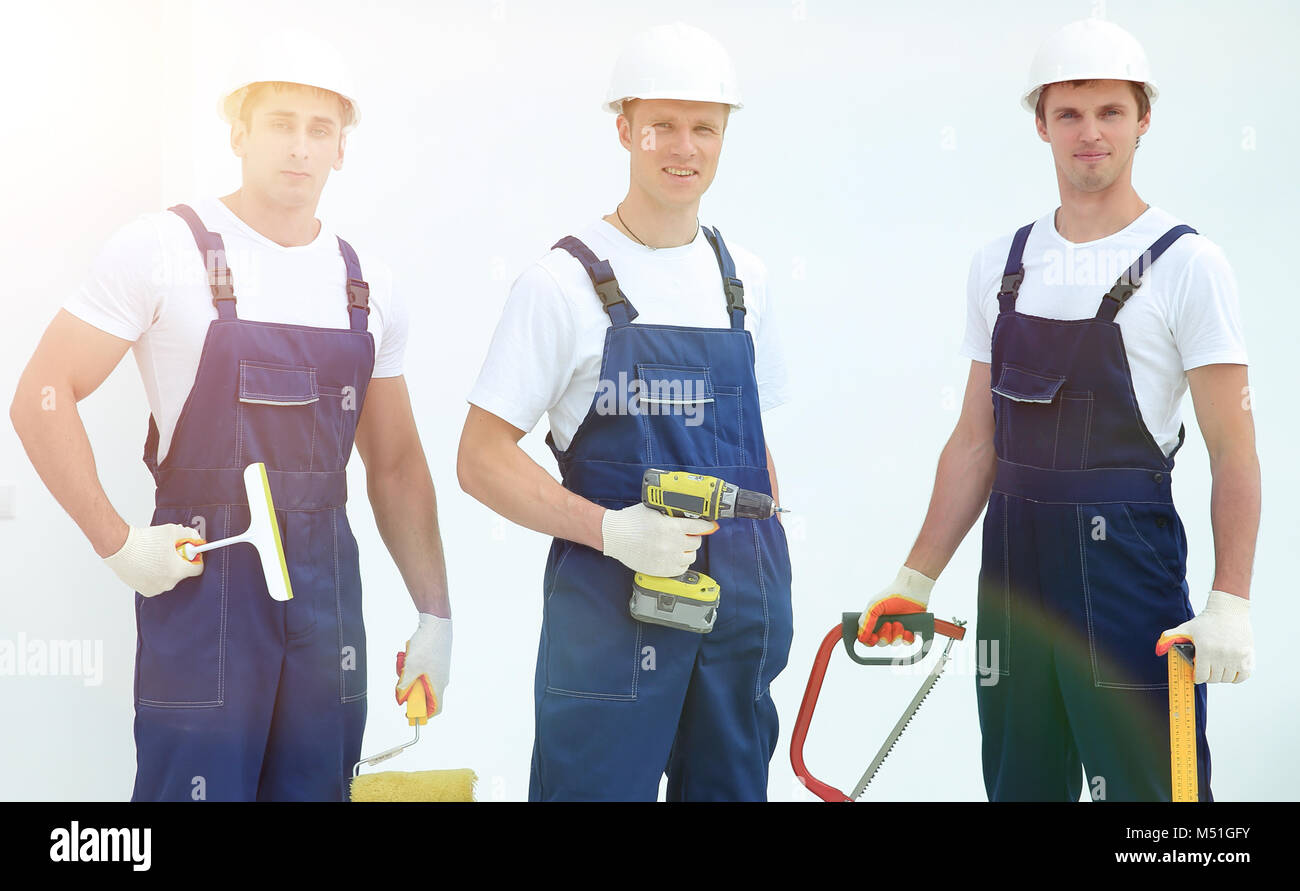 team of construction workers with working tools Stock Photo - Alamy