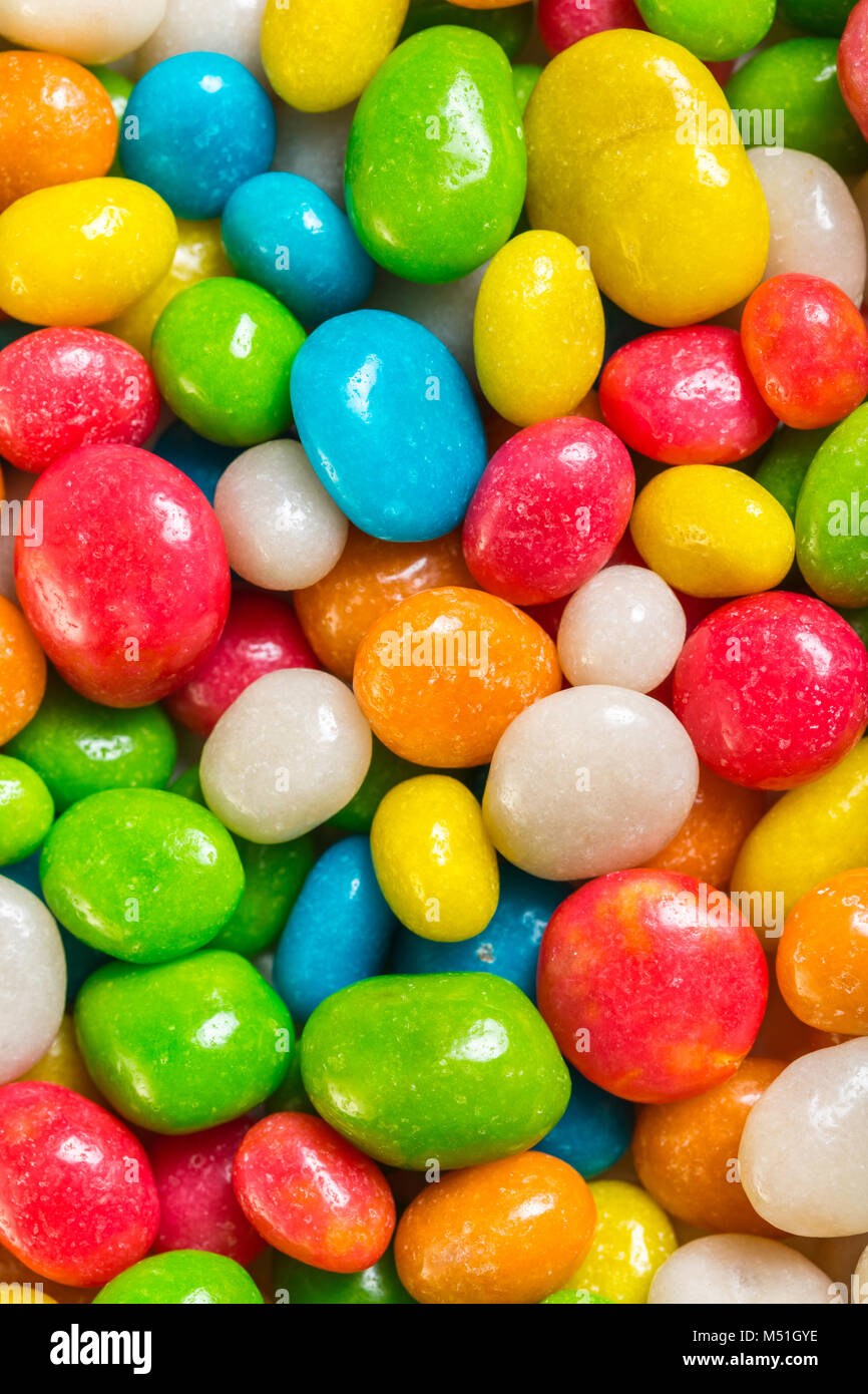 food background of round candy in multicolored glaze Stock Photo - Alamy