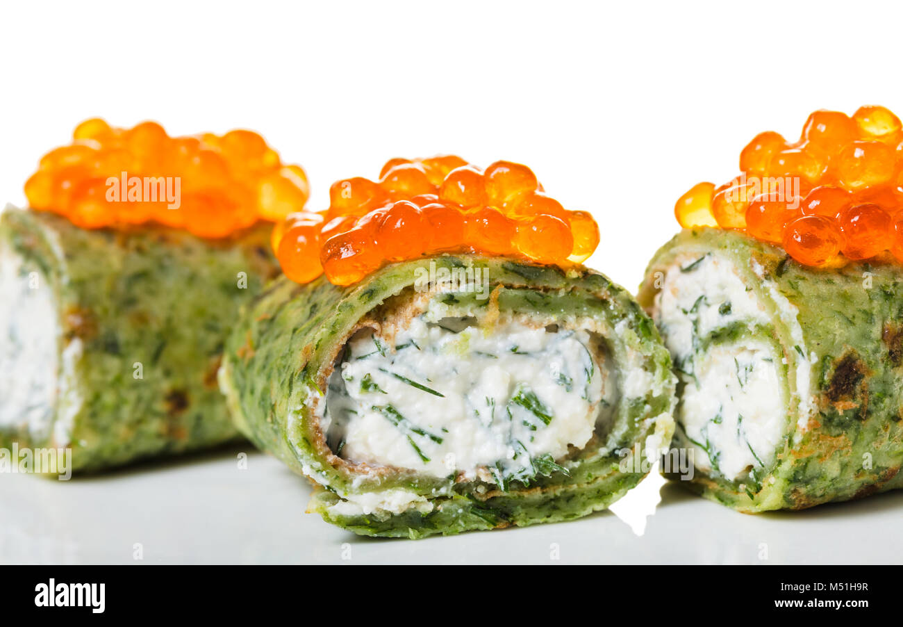 pancakes with spinach and red caviar on white background Stock Photo ...
