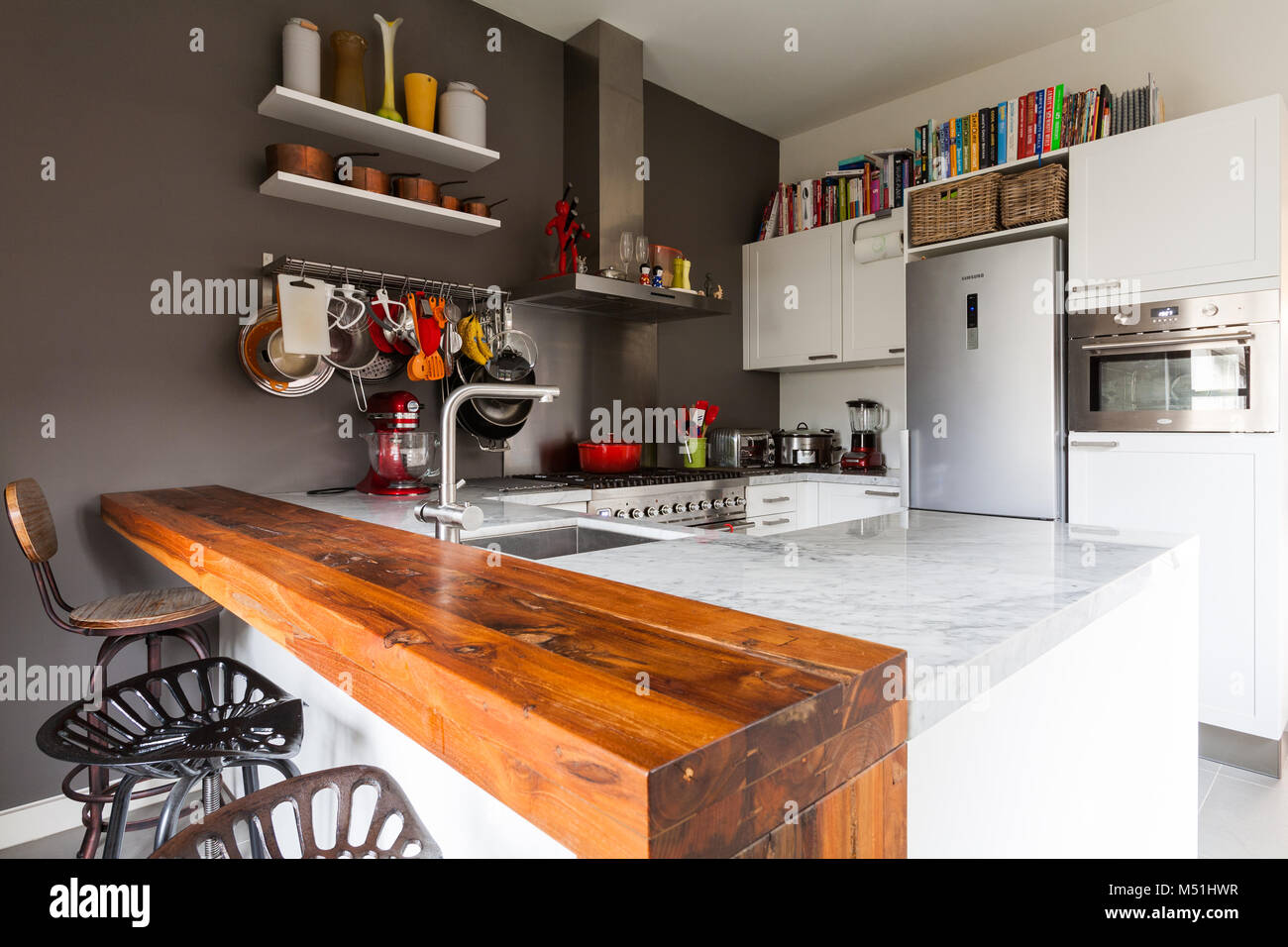 A beautiful modern kitchen equipped with a variety of kitchen equipment ...