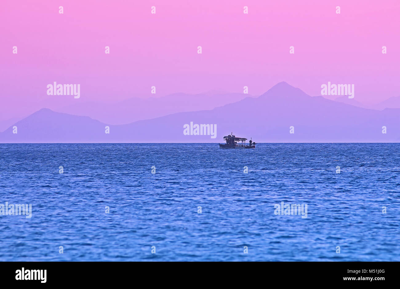 Pink sunset in Greece Stock Photo - Alamy