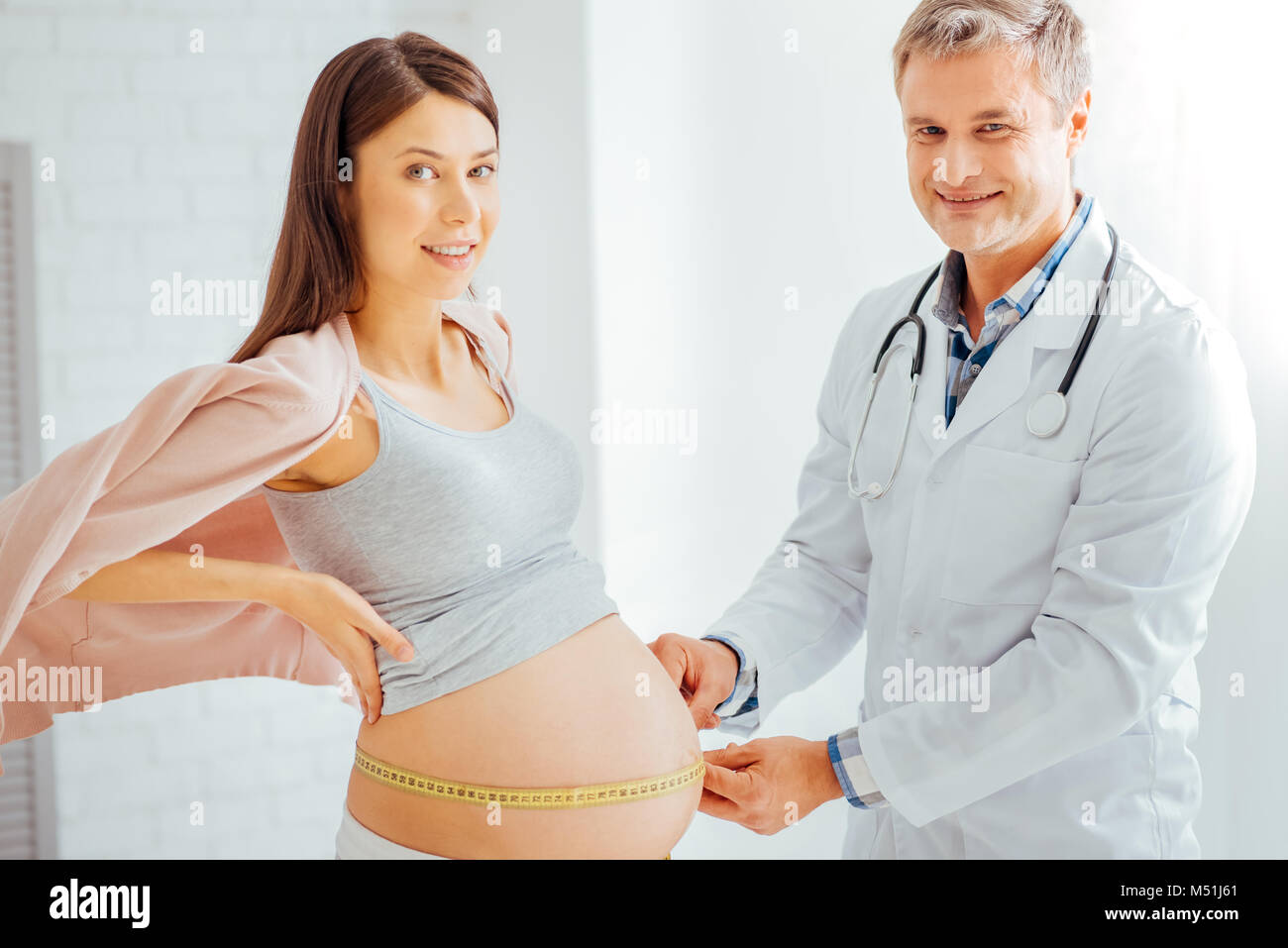 Nurse measuring pregnant belly hi-res stock photography and images - Alamy