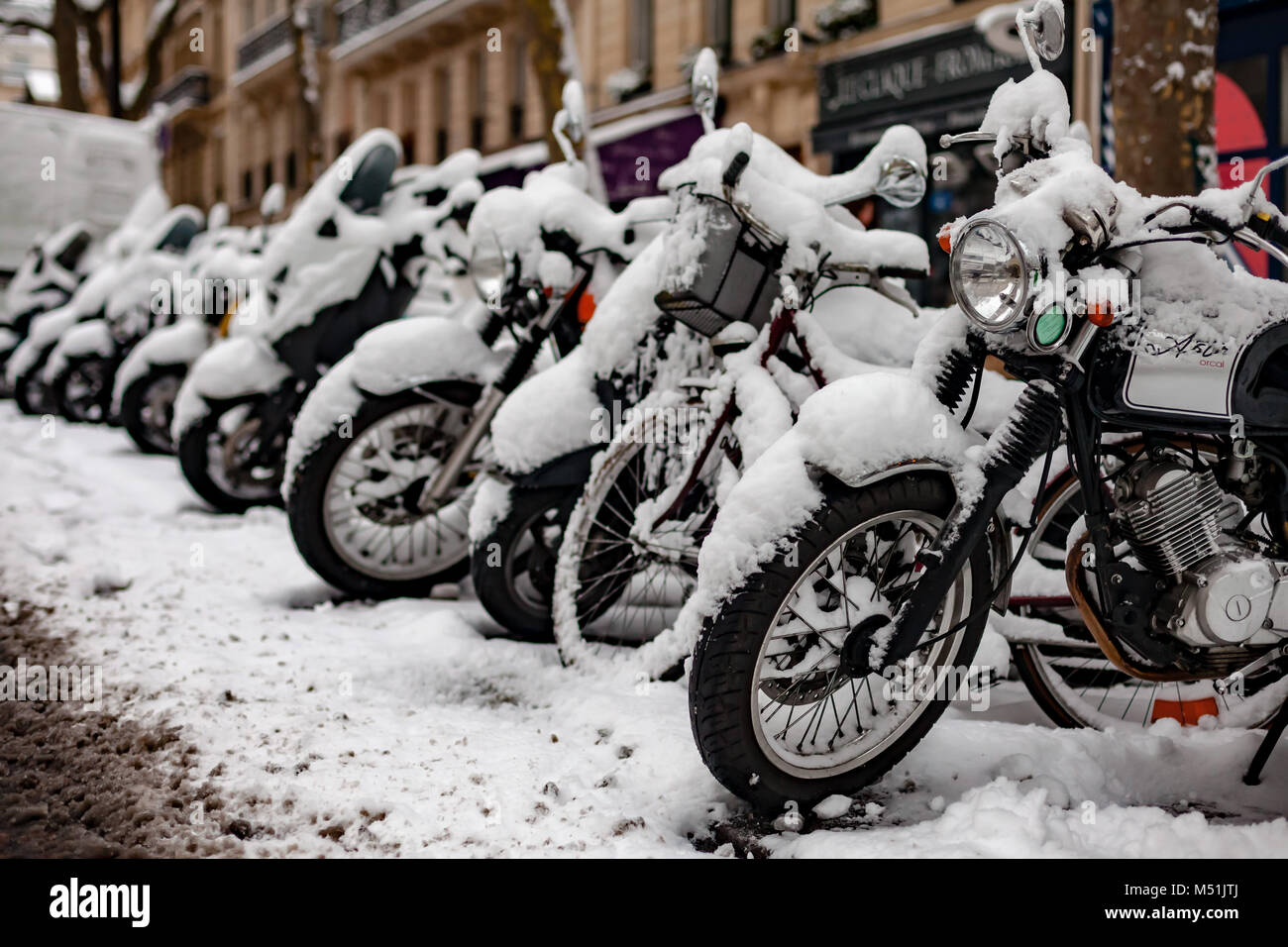 Motorbike covered in snow hi-res stock photography and images - Alamy