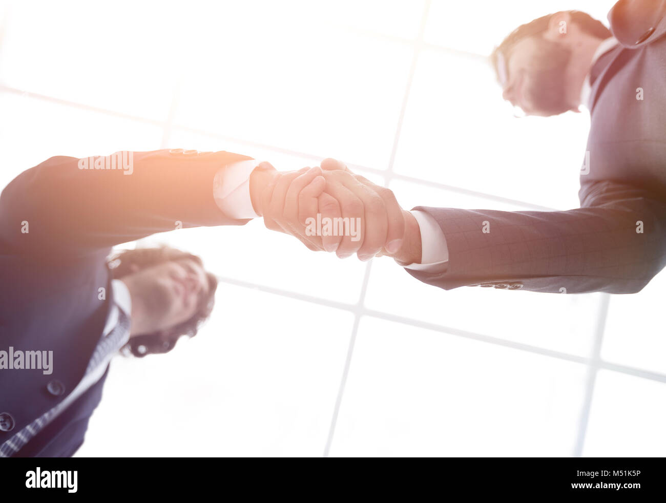 Two business people are holding hands to business cooperation Stock ...