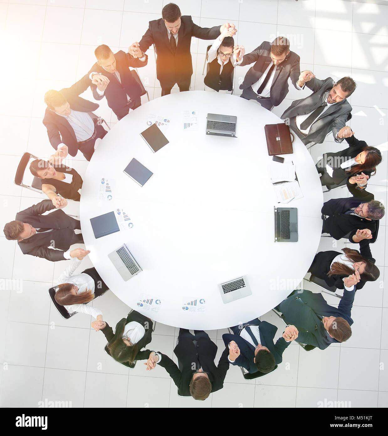large business team sitting at the round table and raising his h Stock ...
