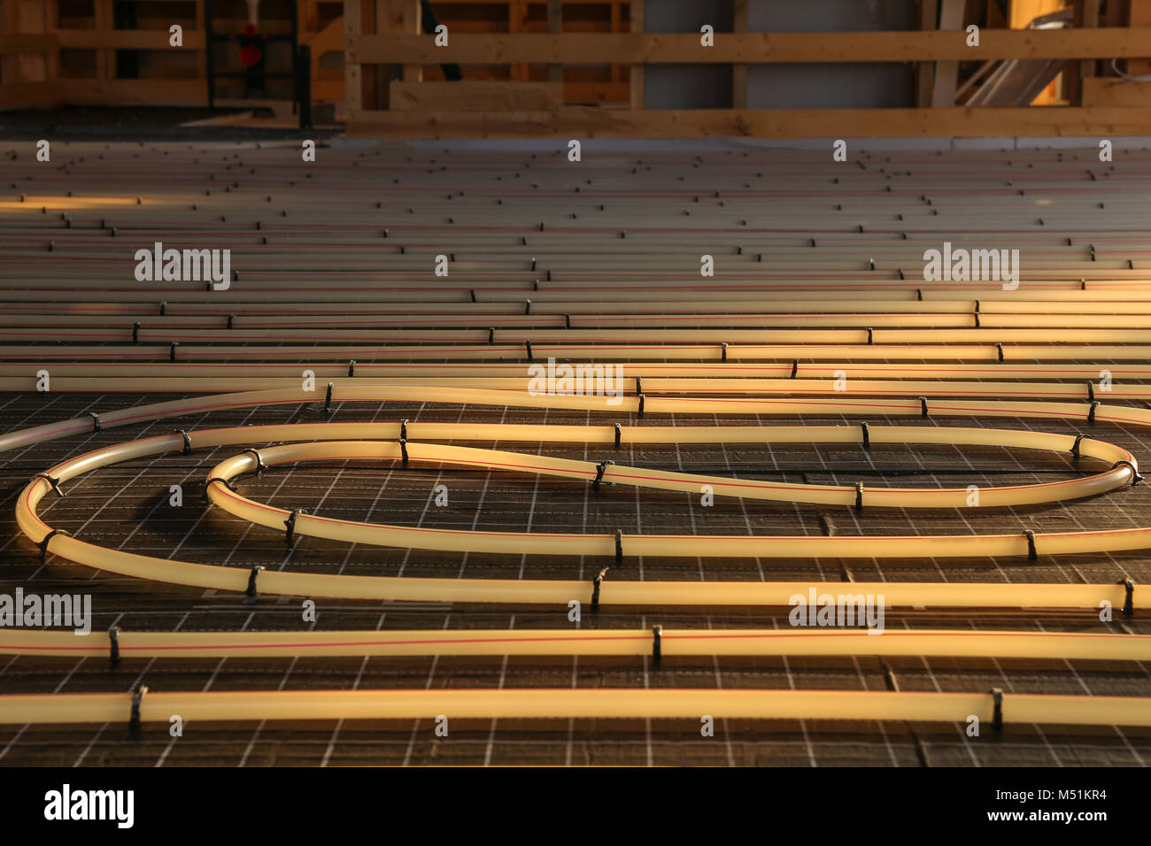 Construction of house. Tubing are elements of radiant floor heating ...