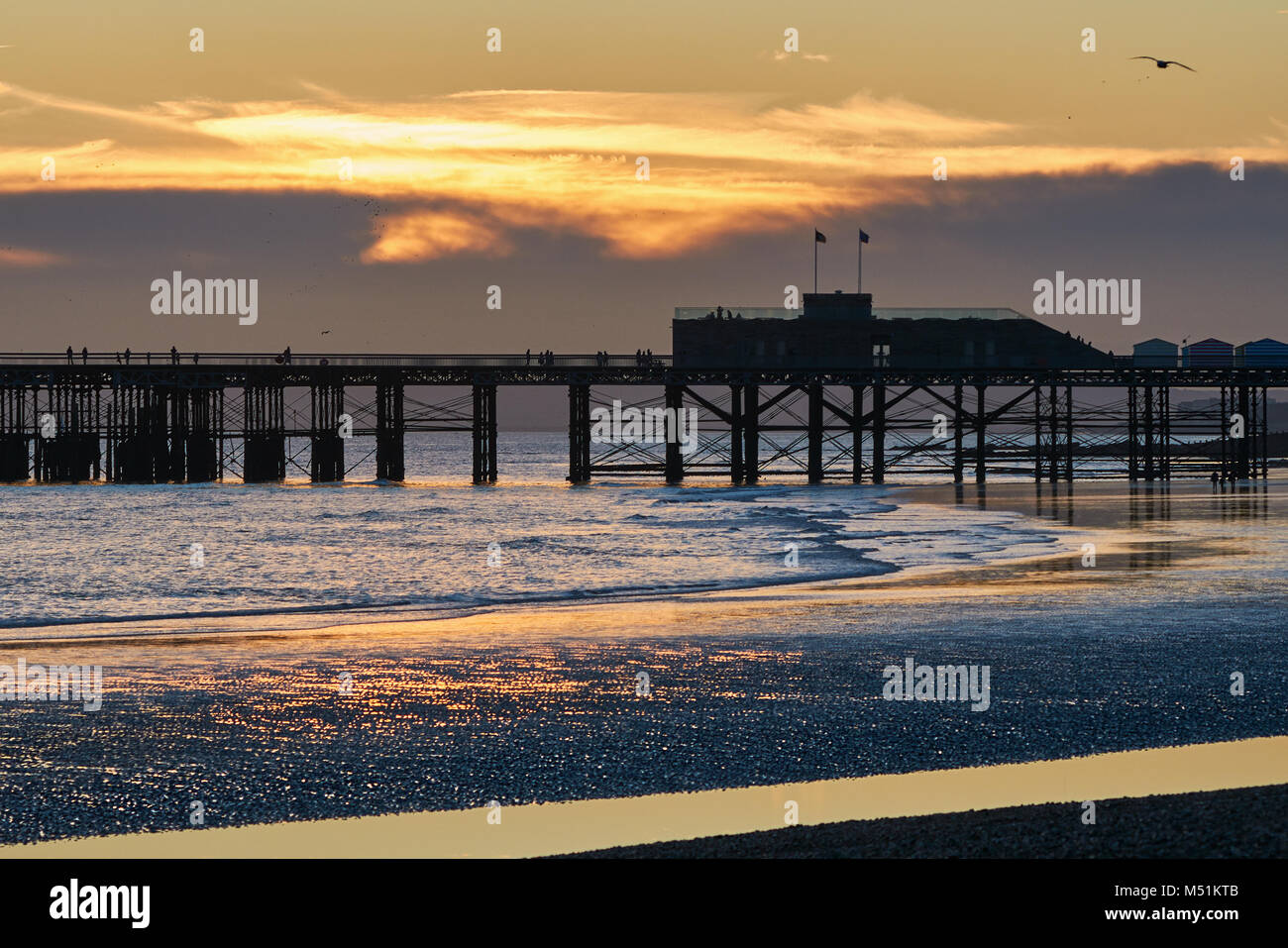 Silhouette hastings pier beach sunset hi-res stock photography and ...
