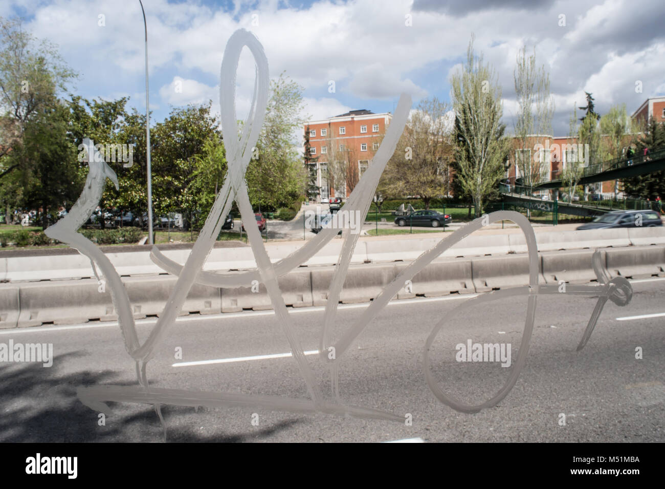 Graffiti tag on a bus window, Madrid, Spain Stock Photo - Alamy