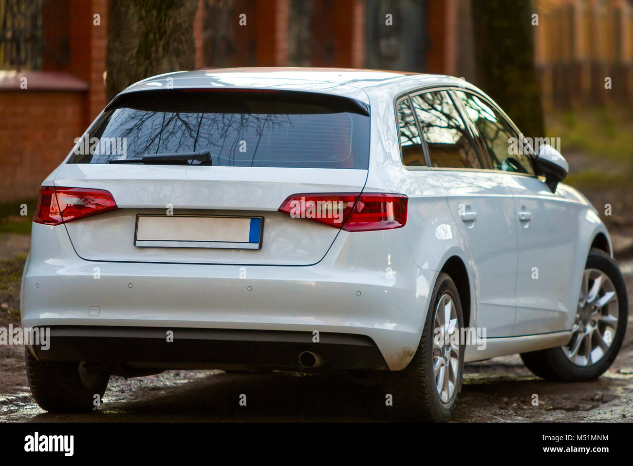 Close-up view of a new modern car parked on the side of the street ...