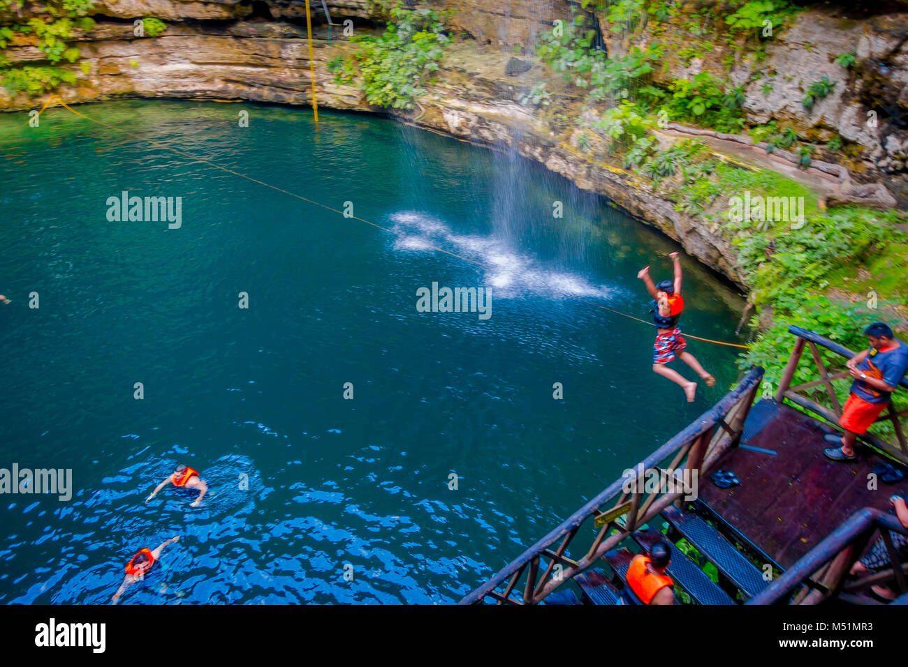 CHICHEN ITZA, MEXICO - NOVEMBER 12, 2017: Unidentified people swimming ...