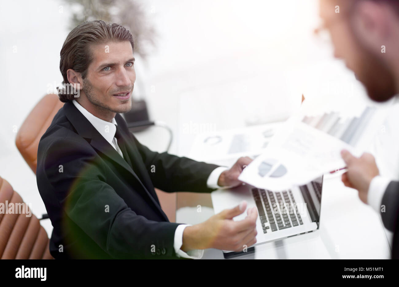 employee gives the Manager the financial report Stock Photo - Alamy