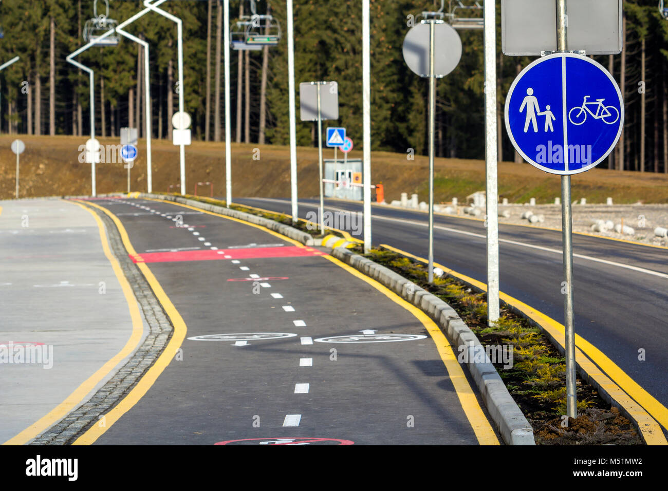 Walk way and bicycle lane signs on the asphalt road surface Stock Photo ...