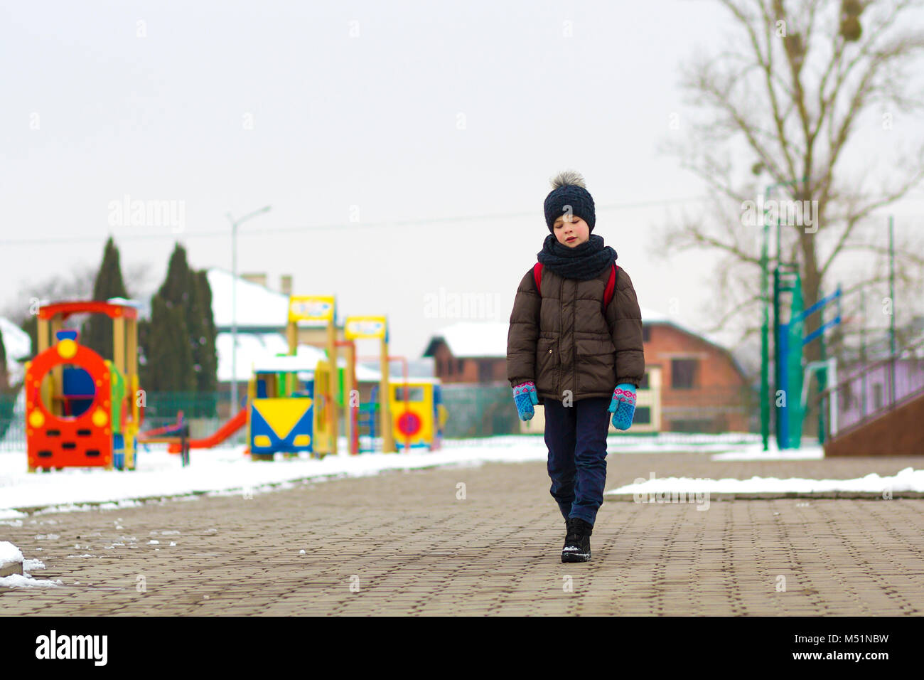 Little boy walking in the park. Child going for a walk after school ...