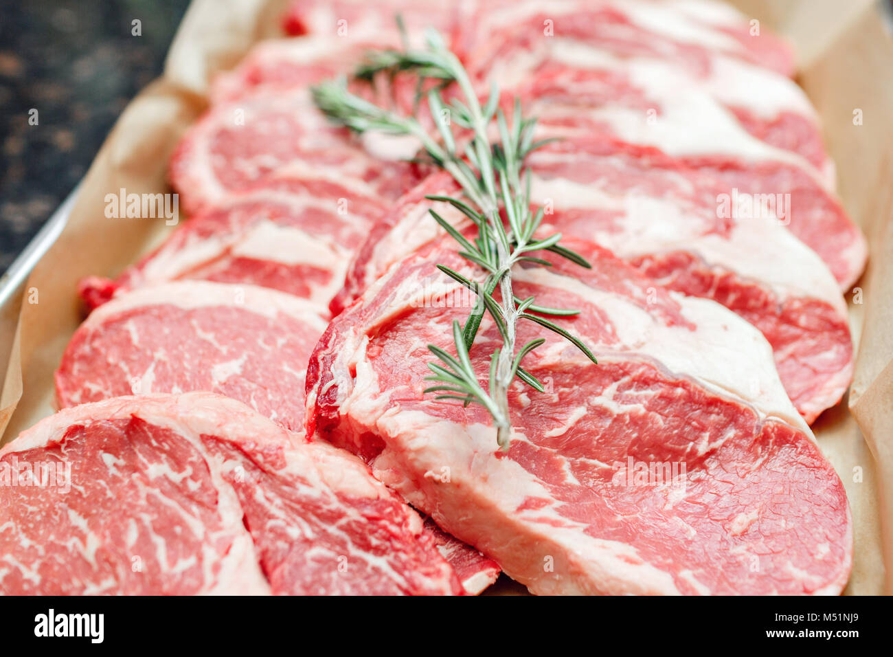 Selection of different cuts of fresh raw red meat in a supermarket ...