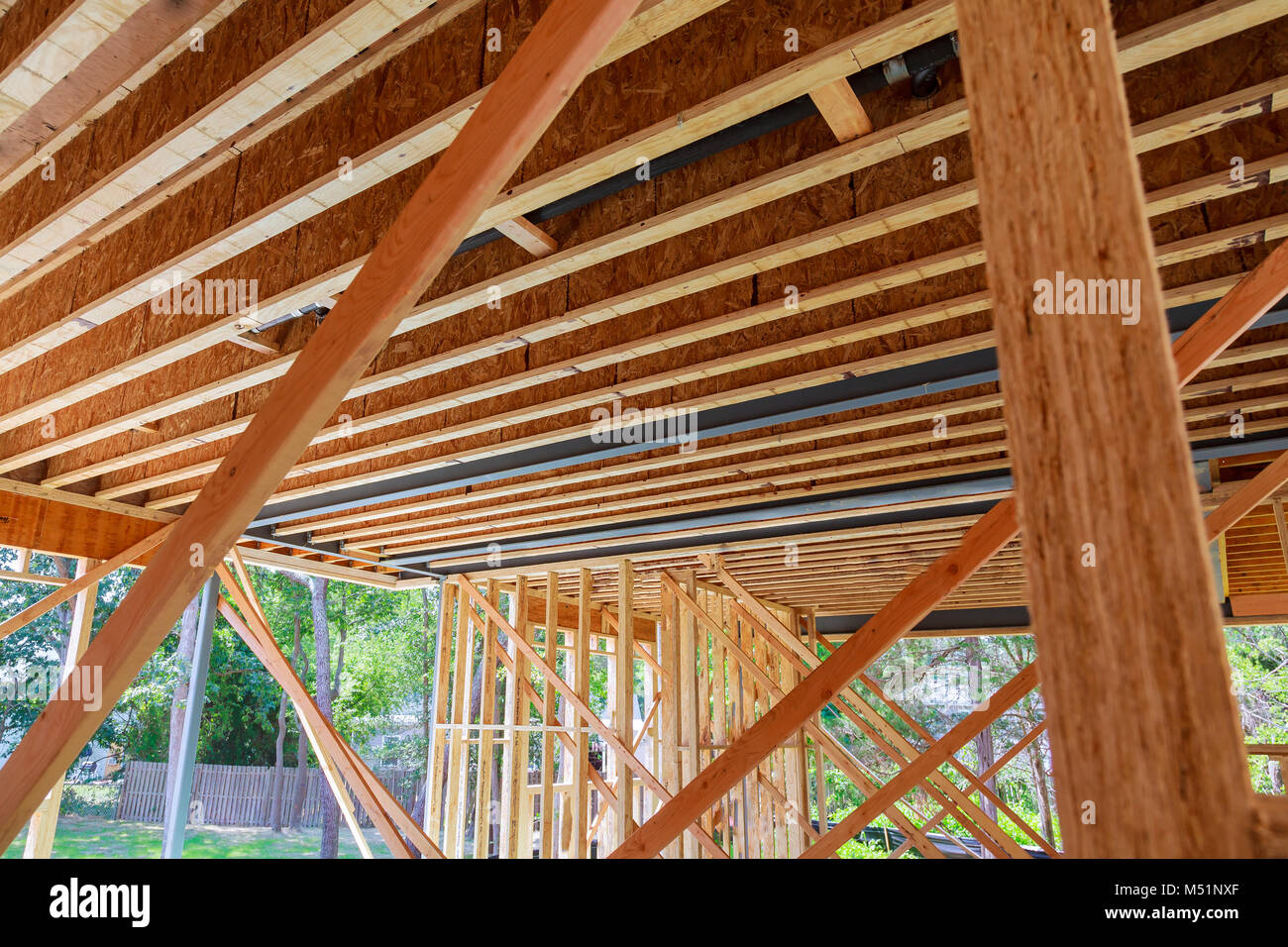 Wood frame interior of a new house under construction Stock Photo - Alamy