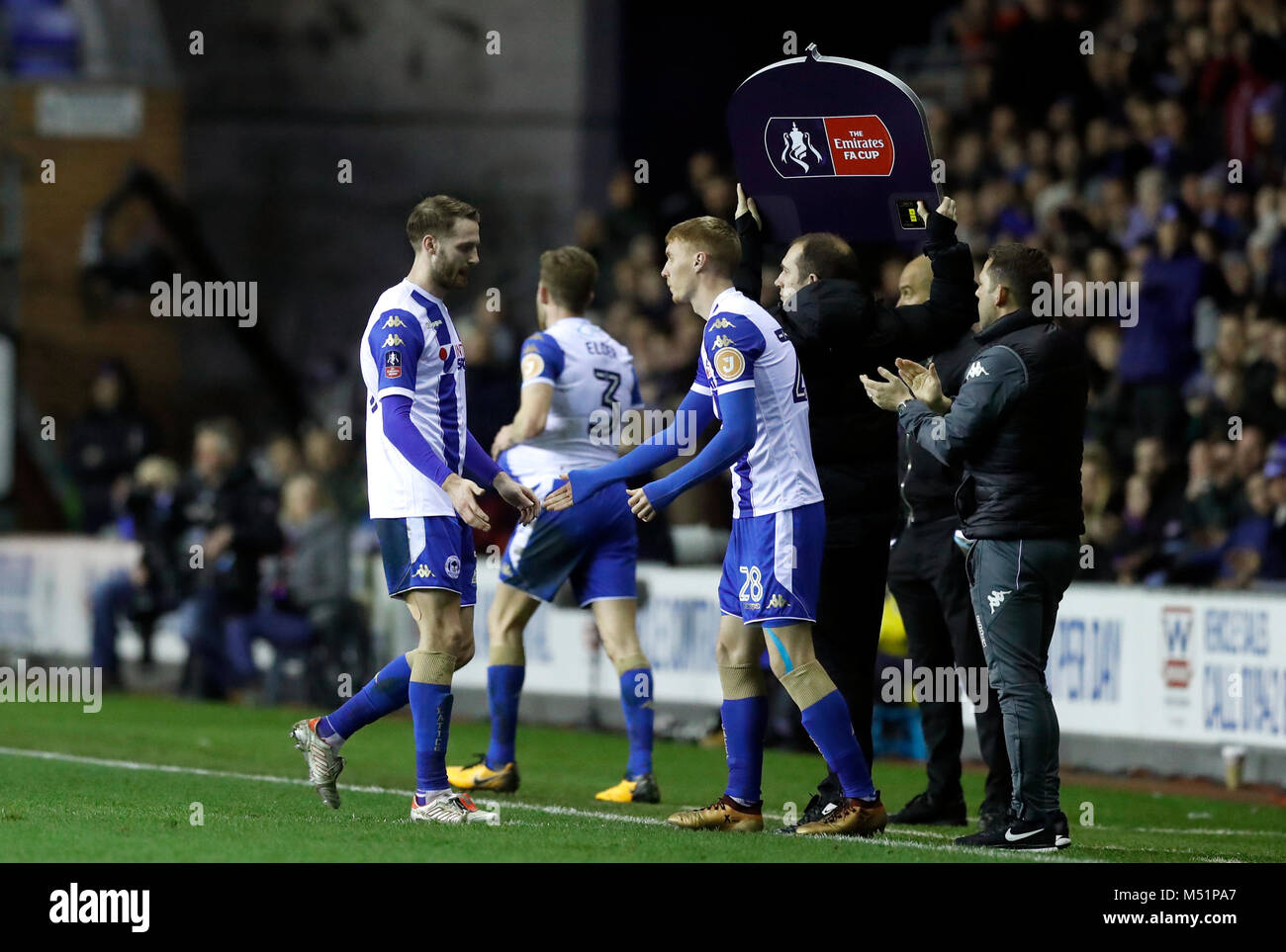 Wigan Athletic's Nick Powell is replaced by Jay Fulton after picking up ...