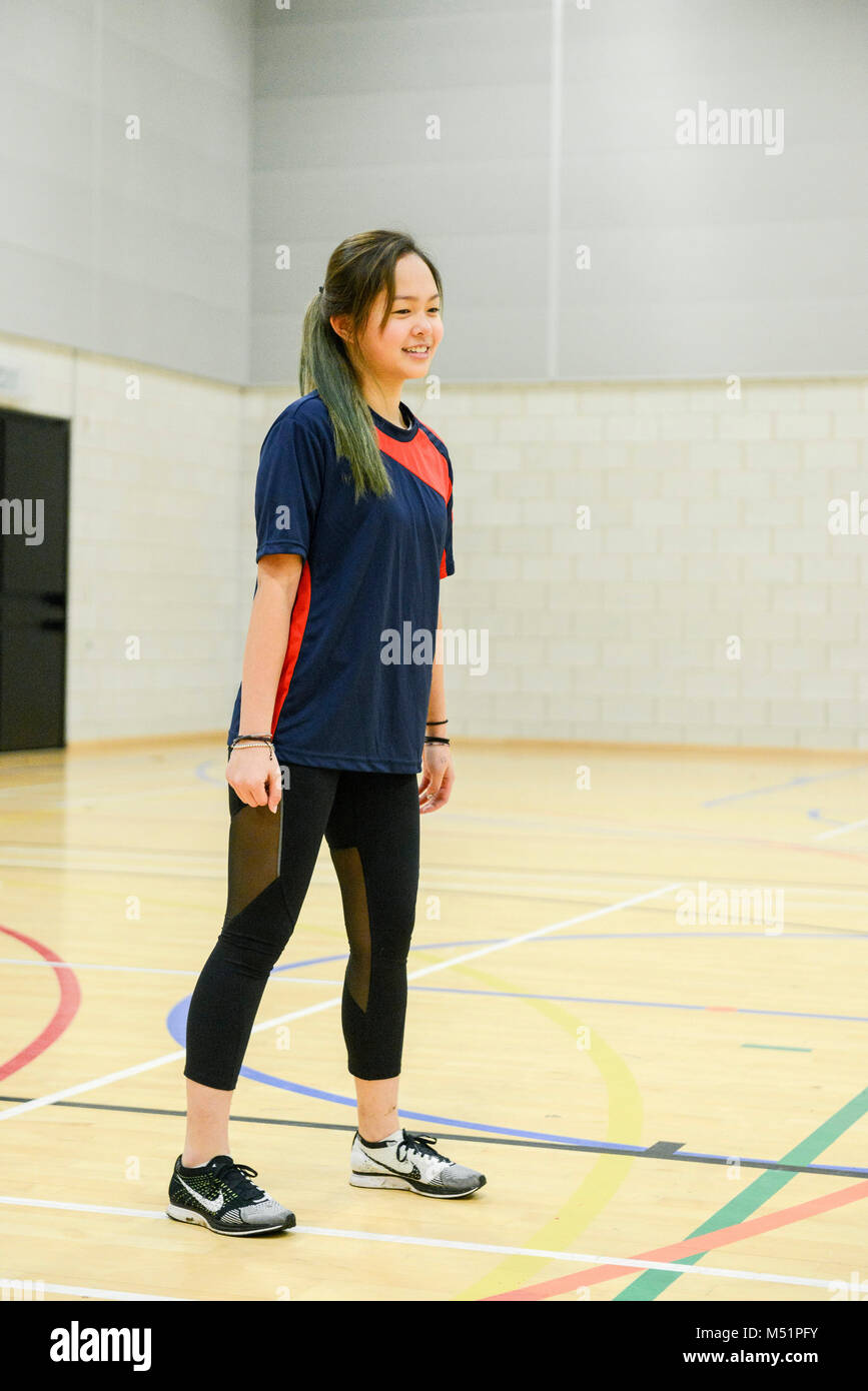 school students playing sports in the indoor sports hall at their ...