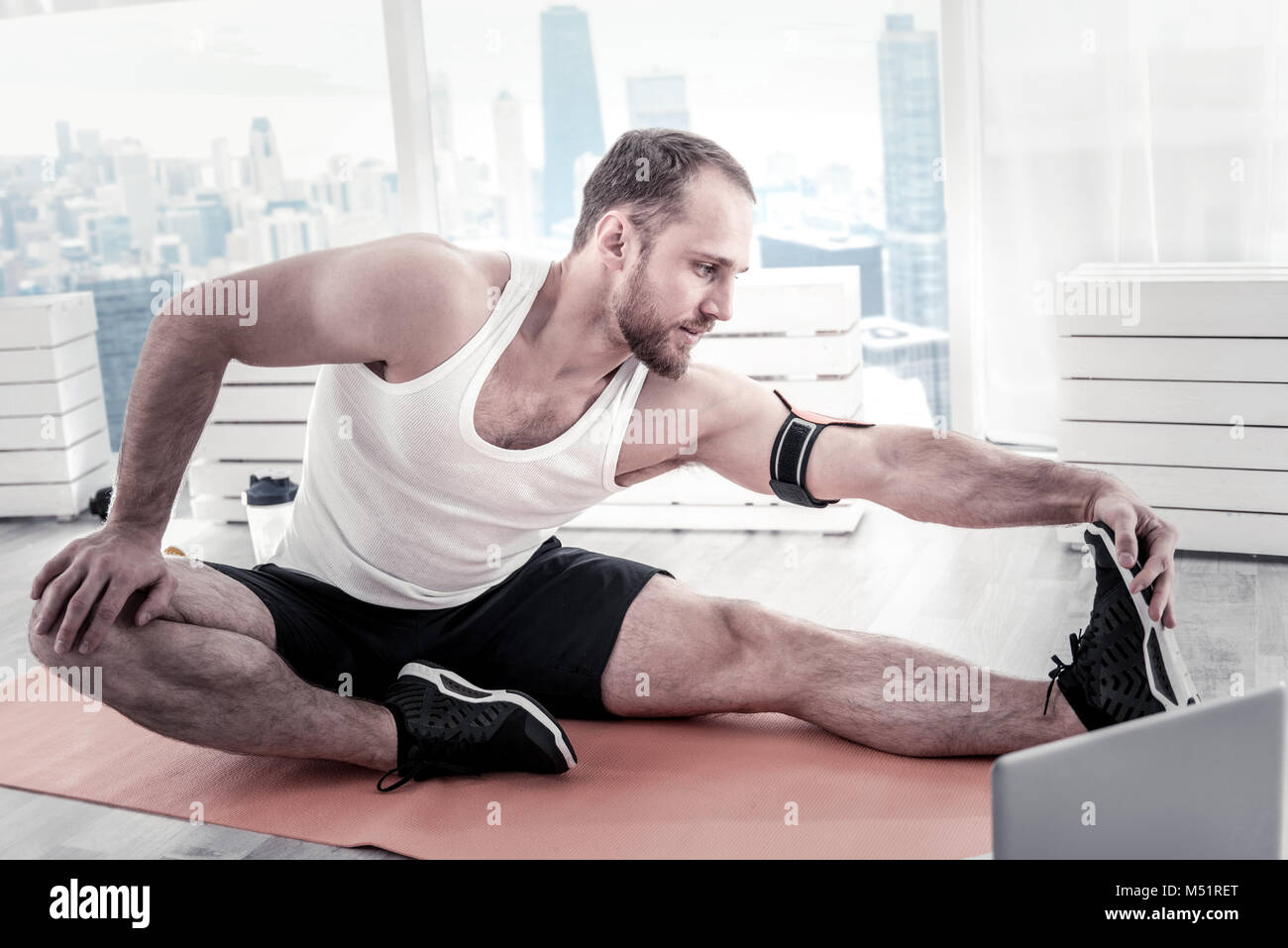 Concentrated vigorous sportsman going in for sports Stock Photo - Alamy