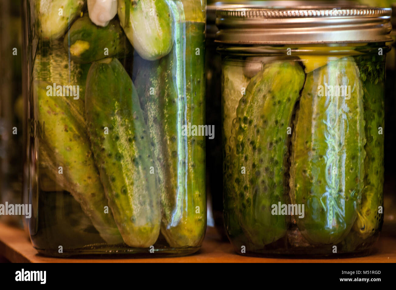 Two bottles of Dill Pickles in a Quart and Pint bottle Stock Photo - Alamy