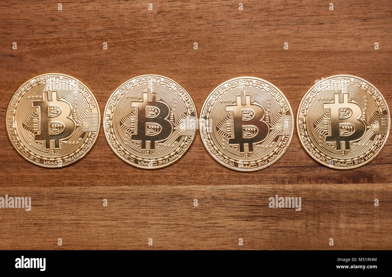 Four golden coins hi-res stock photography and images - Alamy